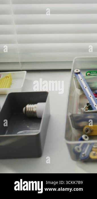 Close Up of STEM Building Set and Plasticine Lying in Plastic Boxes in ...