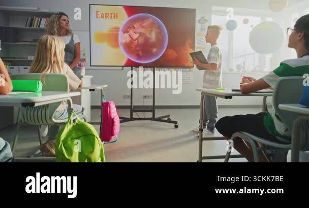 Elementary School Boy with Tablet Computer Giving Presentation About ...