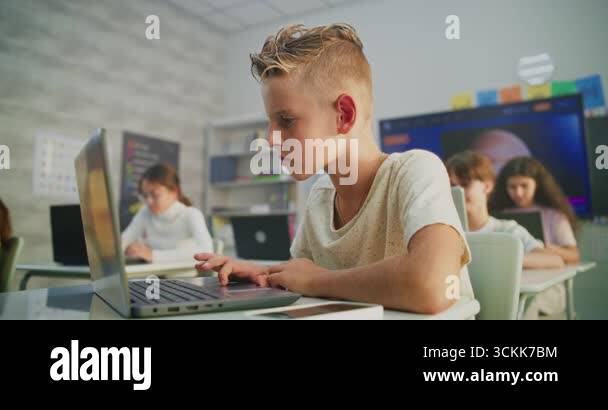 Elementary School Boy Using Laptop, Creating Project During Digital Art ...