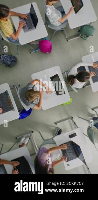 Elementary School Children Using Laptops, Creating Drawings During ...