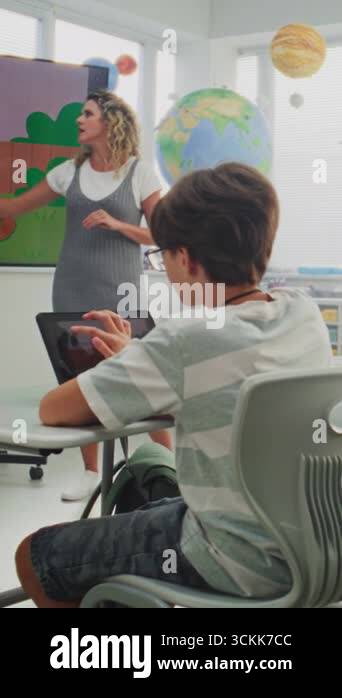 Elementary School Children Drawing Pictures on Laptops During Digital ...