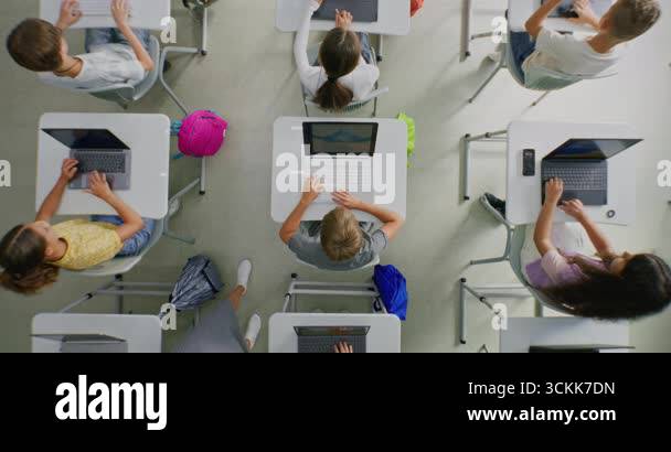 Elementary School Children Using Laptops, Creating Drawings During ...