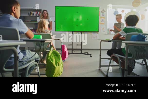 Primary School Boy with Tablet Computer Showcasing Knowledge in Front ...