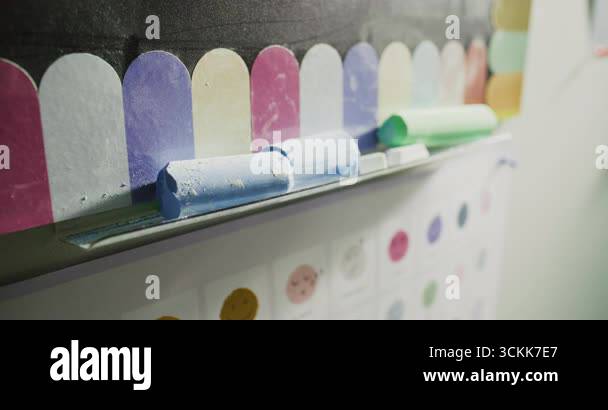 Close Up of Colorful Chalks for Writing or Drawing Lying on Chalkboard ...