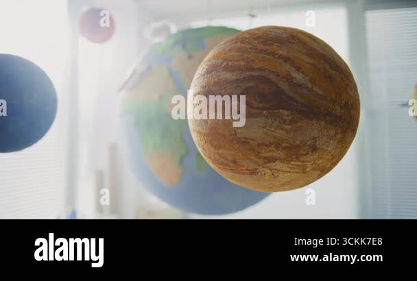 Modern Elementary School Classroom: Close Up of Hanging Models of Solar System and Planets for ...