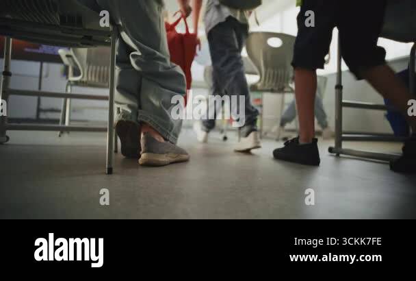 Knee Level Shot of Primary School Children Entering Modern Classroom ...