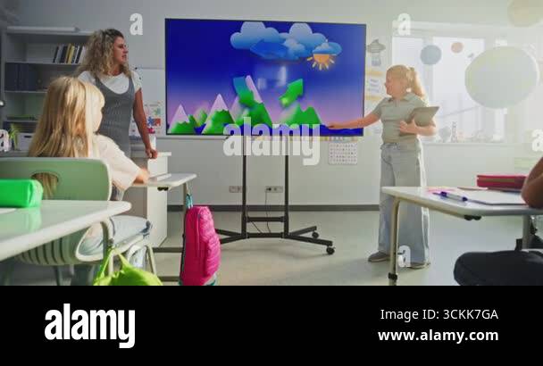 Primary School Girl with Tablet Computer Showcasing Knowledge of ...