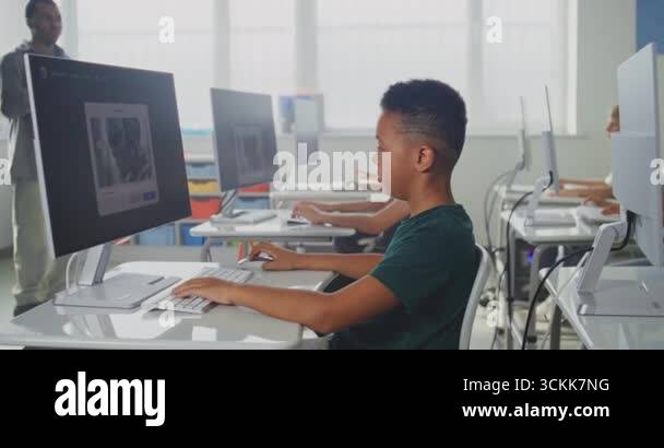 Elementary School Children Using Computers, Creating Illustrations in ...