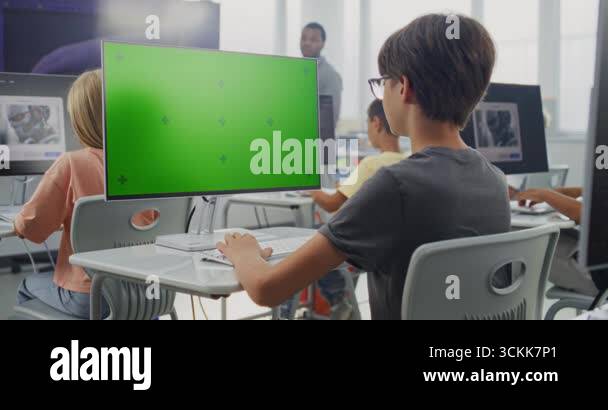 Elementary School Boy Using Computer with Green Screen Template for ...