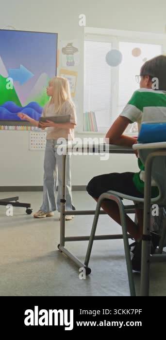 Primary School Girl with Tablet Computer Showcasing Knowledge of ...