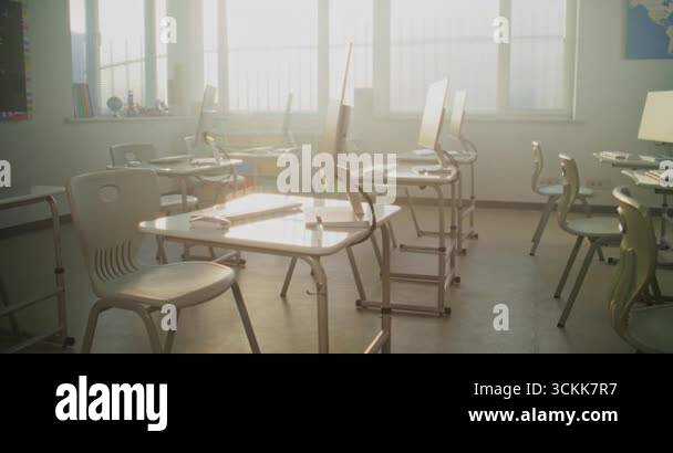 High-Tech School Computer Lab with Minimalist Furniture and PC Monitors ...