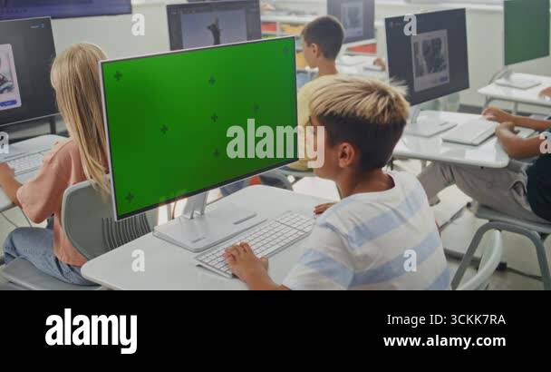 Primary School Boy Working on Creative Project on PC Monitor with ...