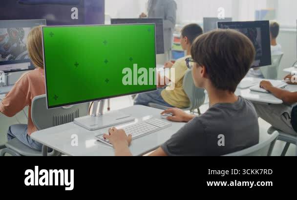 Primary School Boy Working on Creative Project on PC Monitor with ...