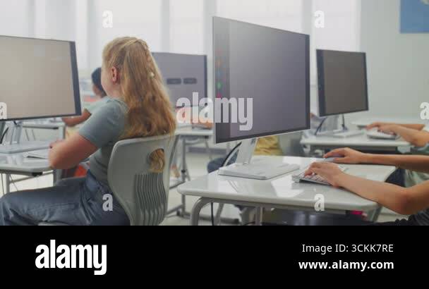 Elementary School Children Using Computers, Creating Digital ...