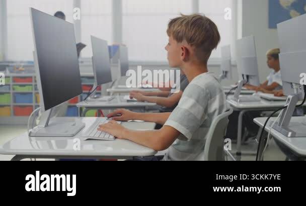 Primary School Students Drawing Pictures on Computers, Working on ...