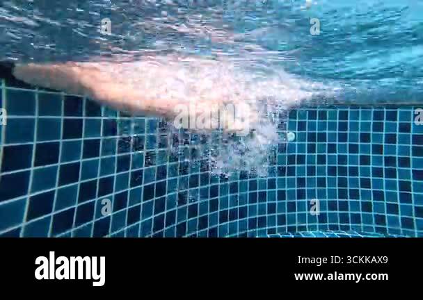 Legs moving underwater, creating bubbles in pool Stock Video Footage ...