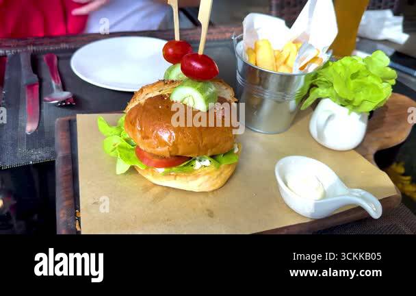 Animation transitions from a real burger to a cartoon with nutritional ...