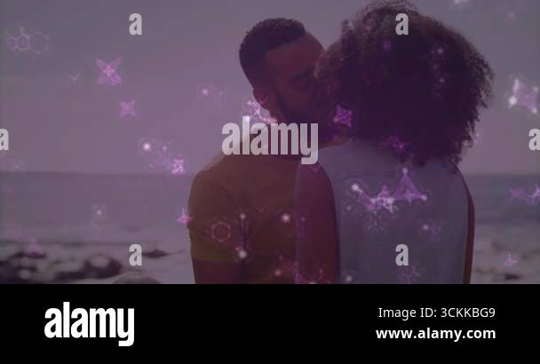 Man cupping woman's face and initiating kiss on shore using AR tech ...