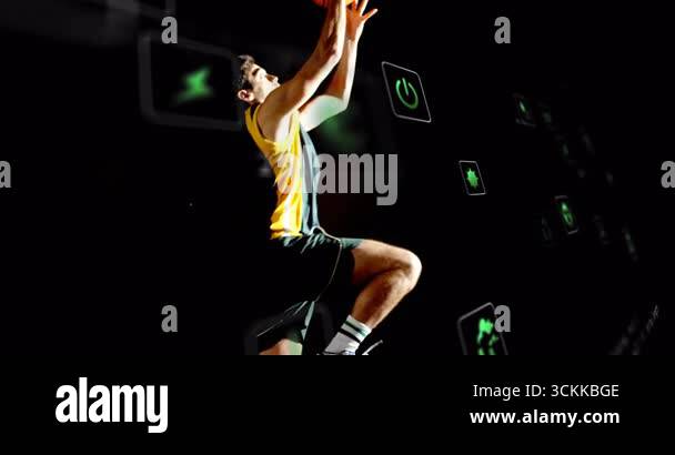 Male basketball player sprinting through gym and dunking as green ...