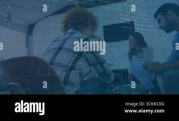 Business team sliding data and pointing at laptop, starting charts and ...