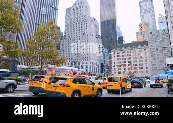 New York, USA, 8 July 2025: Yellow taxi cars in the flow of the ...