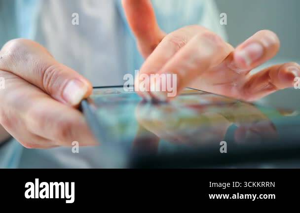 Woman scrolling through social media feeds on smartphone close up ...