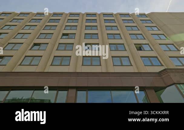 Modern office building with symmetrical windows Low-angle view of a ...