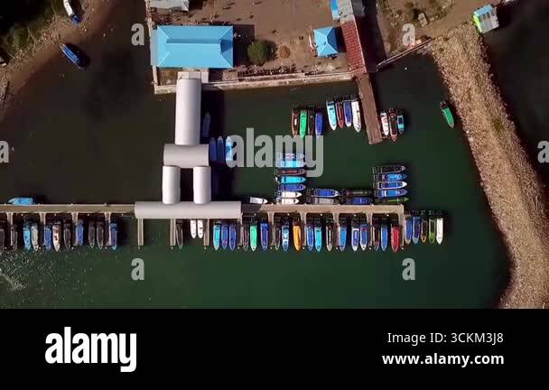 Aerial view of Sofifi harbor with speed boats docked and departing ...