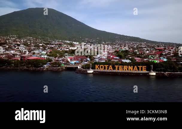 Aerial view of Ternate city with Mount Gamalama in the background ...