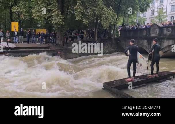 Munich, Germany - July 28, 2025: The Eisbachwelle or Eisbach's surf ...