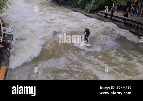 Munich, Germany - July 28, 2025: The Eisbachwelle or Eisbach's surf ...