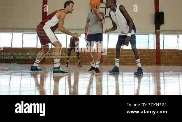 Referee blowing whistle and tossing basketball on gym floor as teams ...