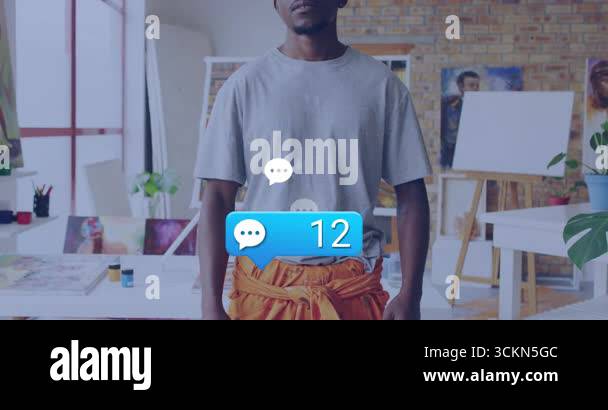 Male artist standing in art studio while chat alert bubble updating ...