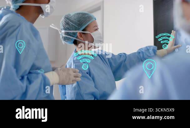 Female surgeon tapping radiograph in operating room, spawning pulsing ...