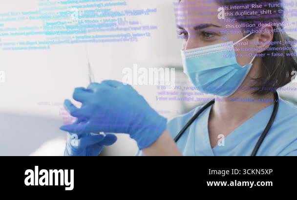 Nurse lifting syringe, drawing dose from vial tapping bubbles as ...