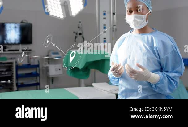 Surgeon standing beside surgical table with first pin appearing ...