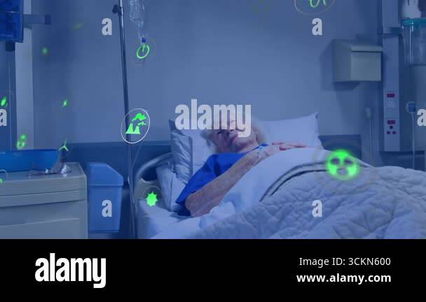 Elderly patient lying in hospital bed tracking green energy icons ...