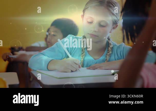 Student finishing writing and lifting gaze in school, starting digital ...