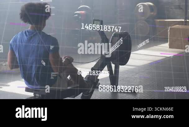 Man rowing in gym, activating numeric data line and grid overlay ...