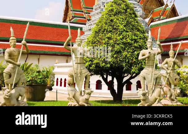 Statues and architecture at a Bangkok temple Stock Video Footage - Alamy