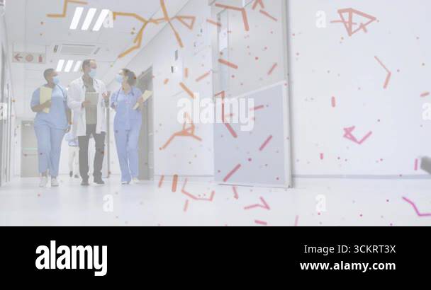 Doctor tapping tablet walking with nurses in hospital reviewing info as ...