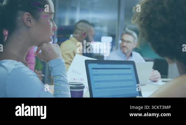 woman picking up report pointing at laptop risk entries with code overlay in security meeting ...