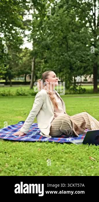 Confident woman studying and working remotely on laptop while sitting ...