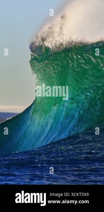 Ocean waves are a mesmerizing sight, their turquoise waters rising and ...