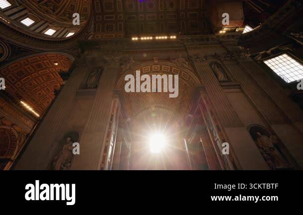 Rome, Italy, 20 August 2025: Sunlight streaming through ornate arches ...