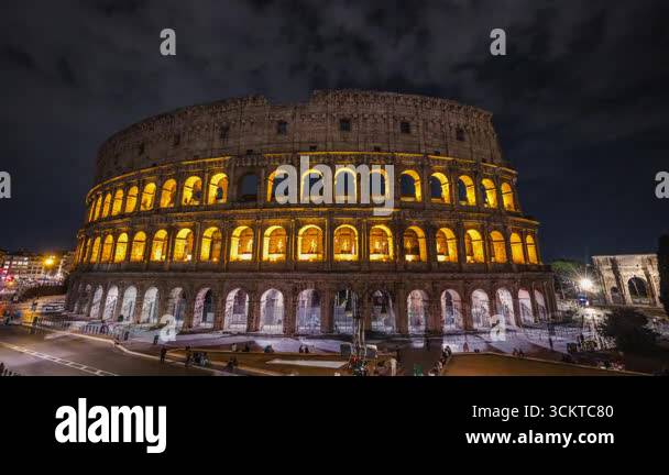 Night timelapse of the illuminated Colosseum in Rome with long exposure ...