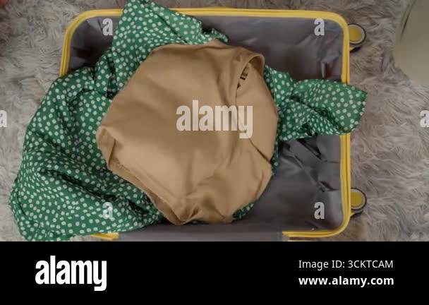 Suitcase clothes Stock Videos & Footage - HD and 4K Video Clips - Alamy
