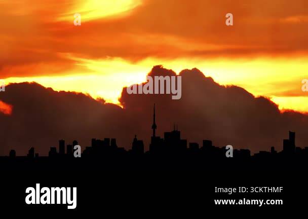 North America skyline silhouette sunset timelapse. City towers and ...