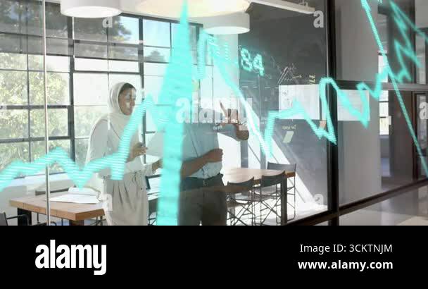 Business analyst pointing to pulsing chart while colleague picking paper and analyzing trend ...