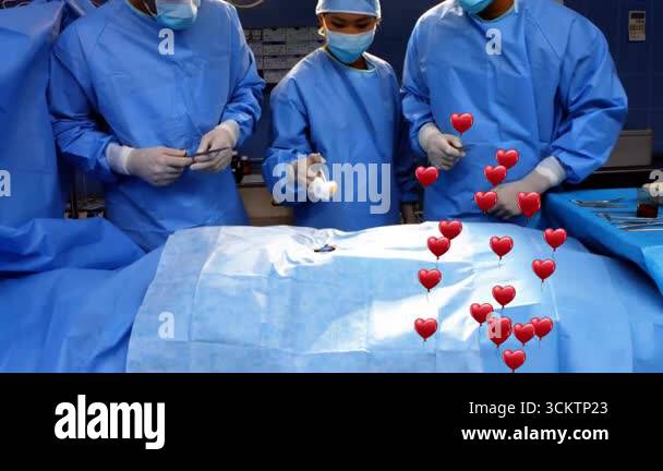 Assistant dabbing surgical gauze to prep area and surgeons dissecting ...
